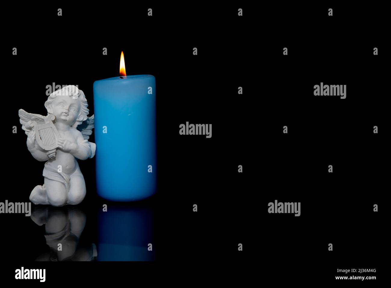 Blue lit candle hi-res stock photography and images - Alamy