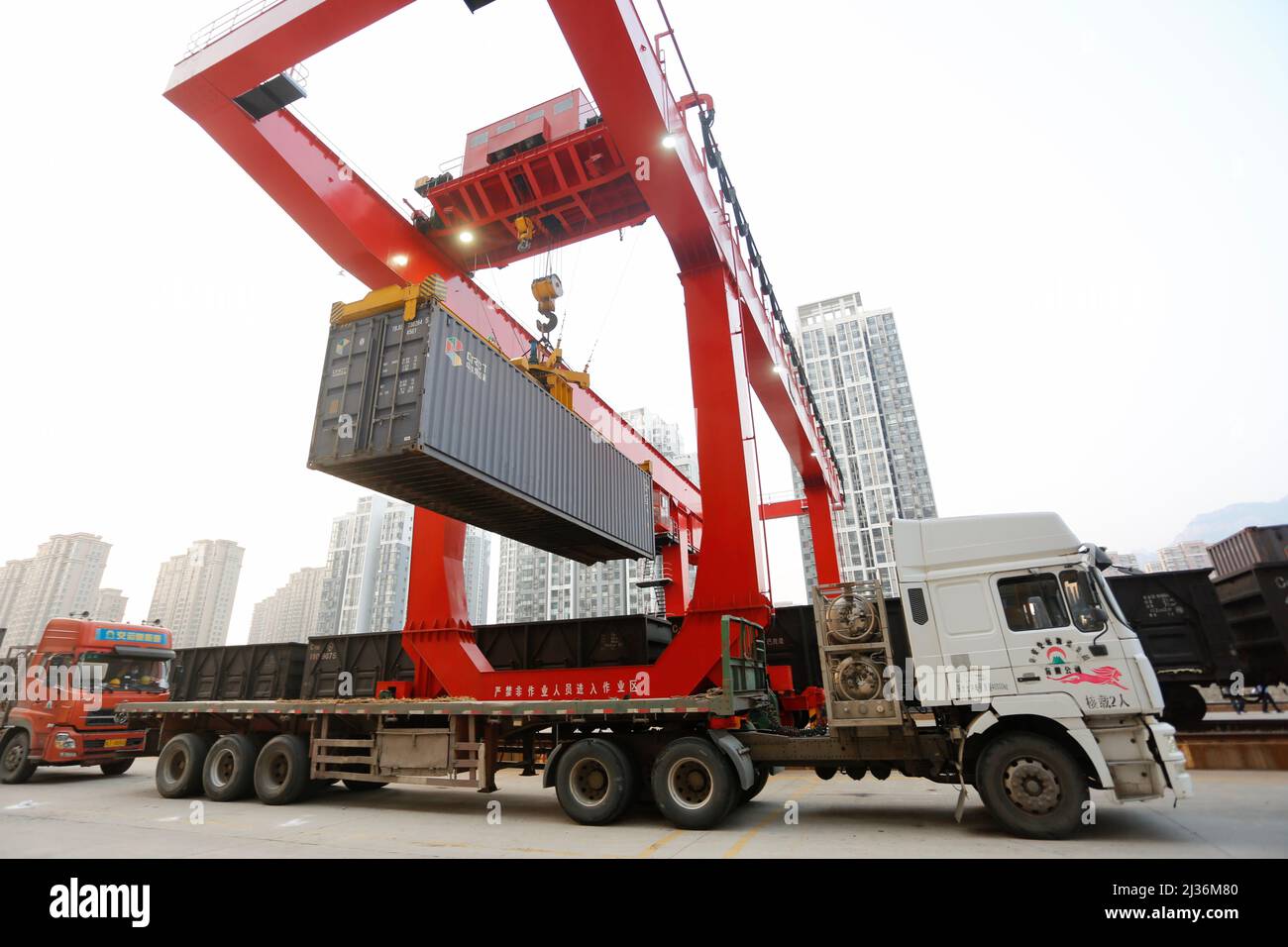 TAI'AN, CHINA - APRIL 5, 2022 - Cranes load containers filled with milk ...