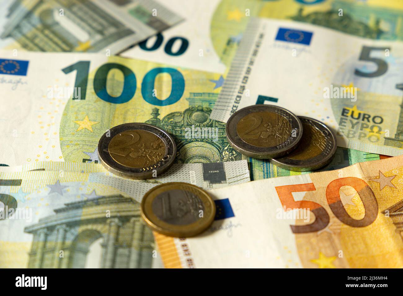 Pile of euro coins on euro banknotes Stock Photo - Alamy