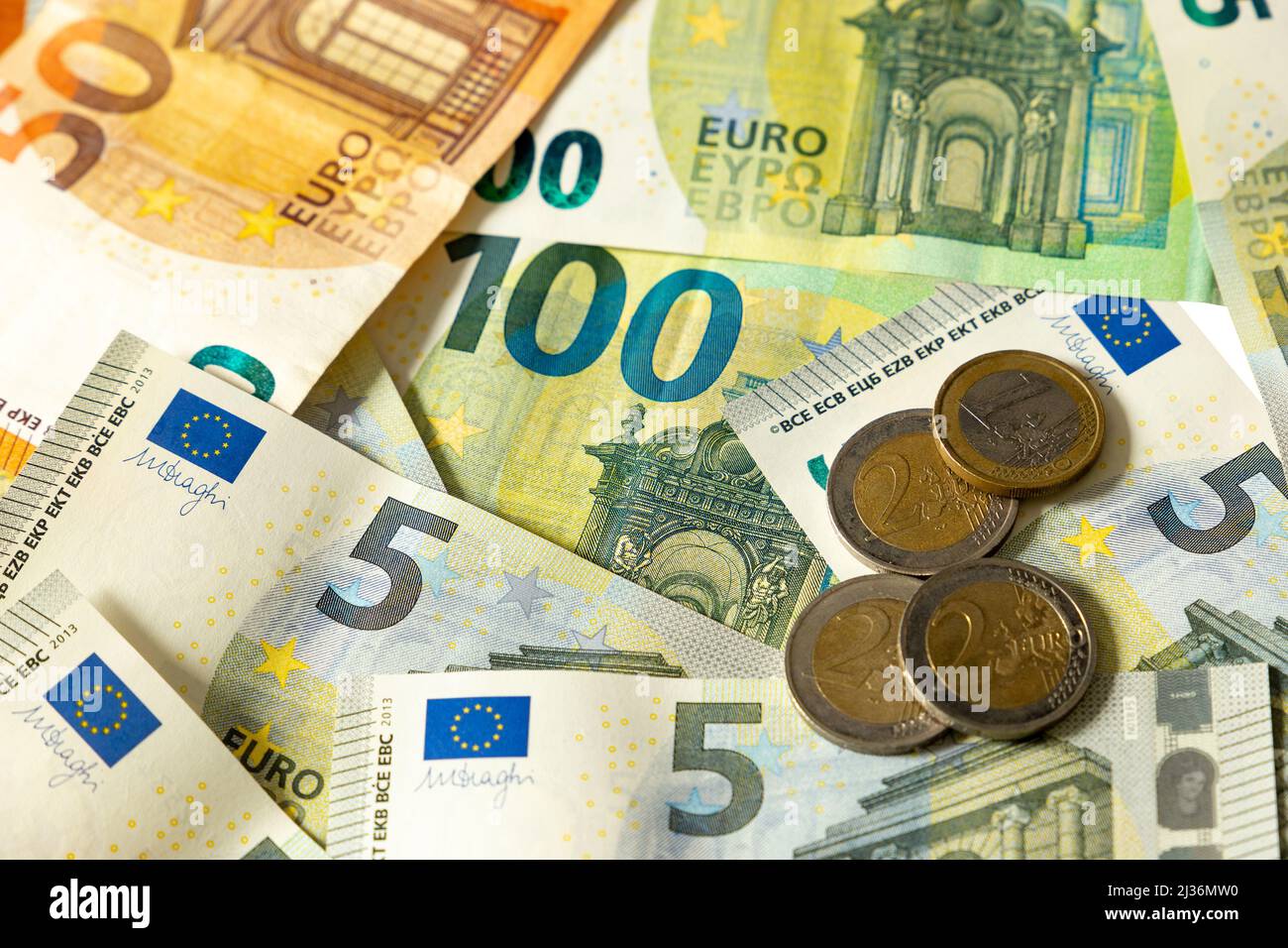 Euro banknotes. table covered with banknotes Stock Photo - Alamy