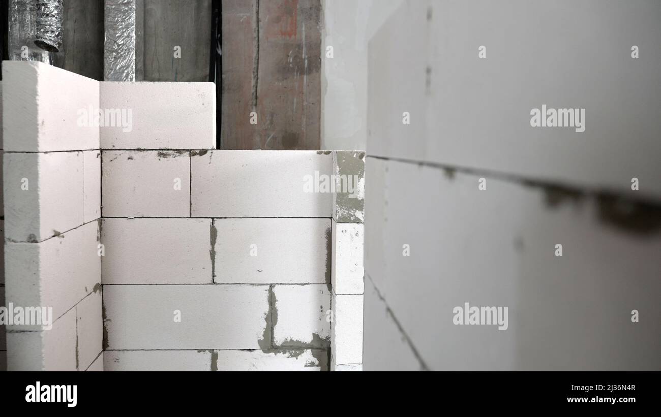 Finished wall of aerated concrete blocks in a new apartment. View of an ...