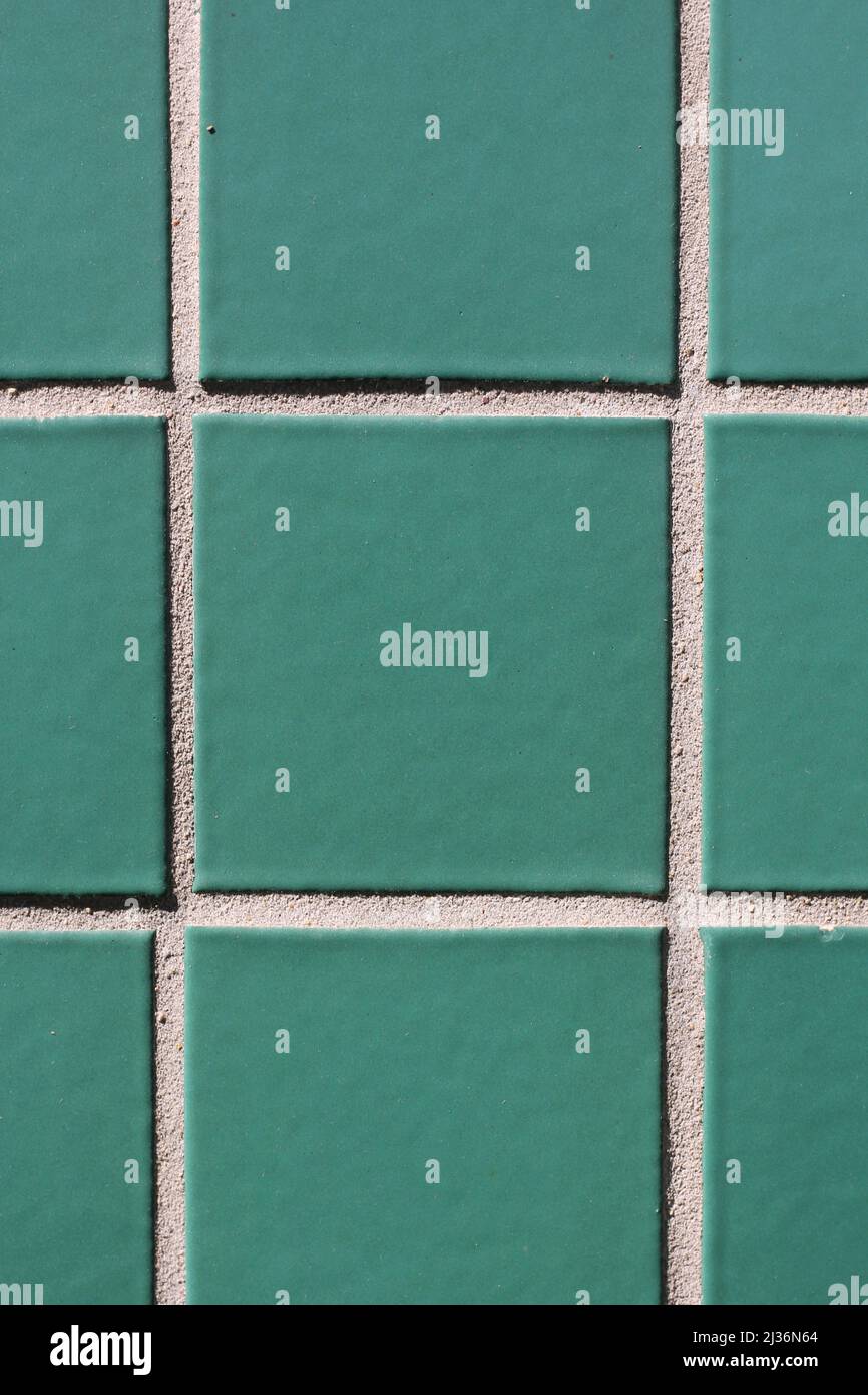 A green square tile grid with white perpendicular lines Stock Photo - Alamy