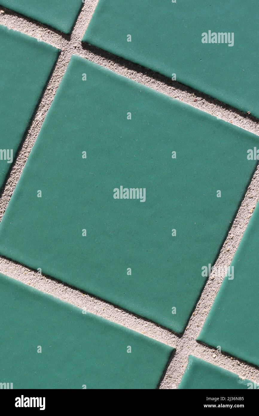 A green square tile grid with white perpendicular lines Stock Photo - Alamy