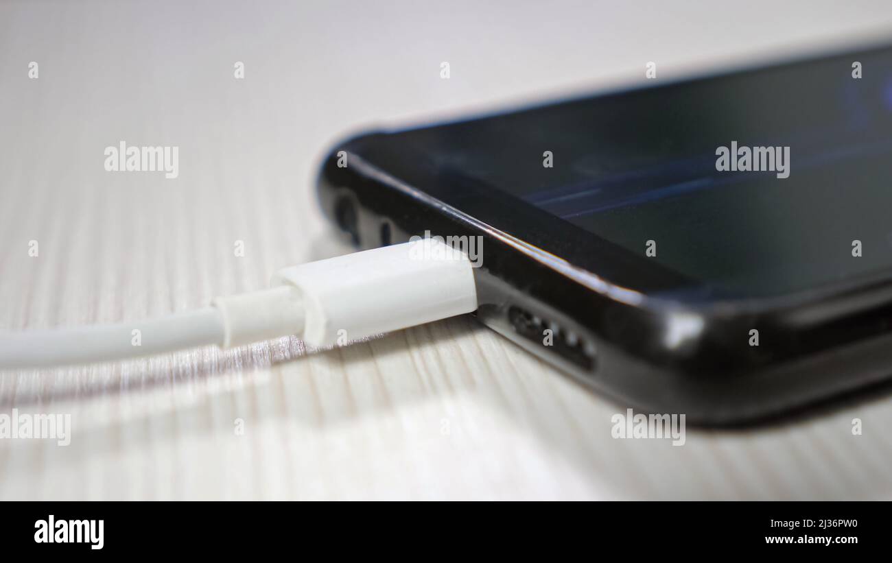 the fast charging connection to your phone by wire Stock Photo - Alamy