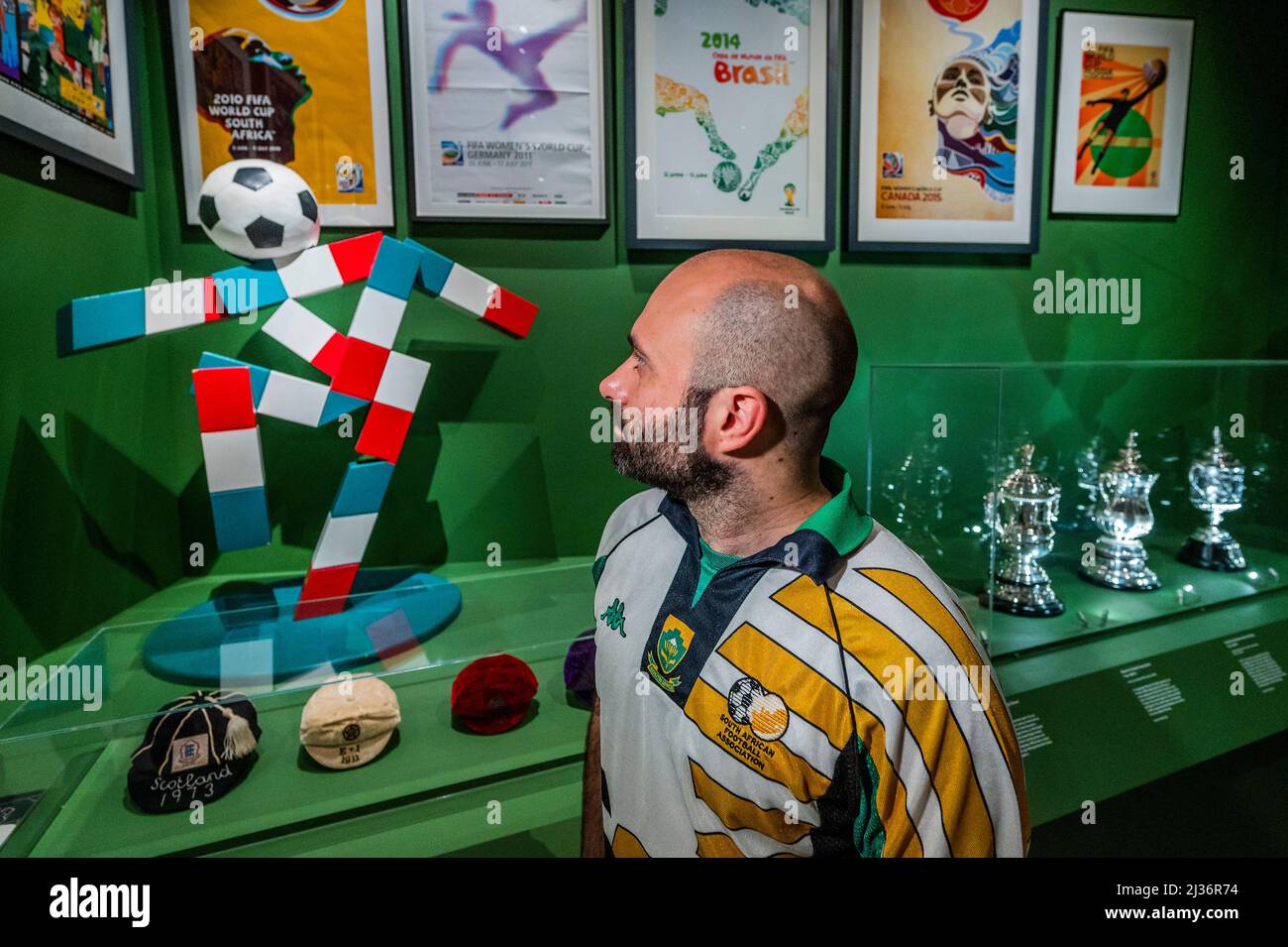 London, UK. 6th Apr, 2022. The Italia 90 mascot with FA trophies behind ...