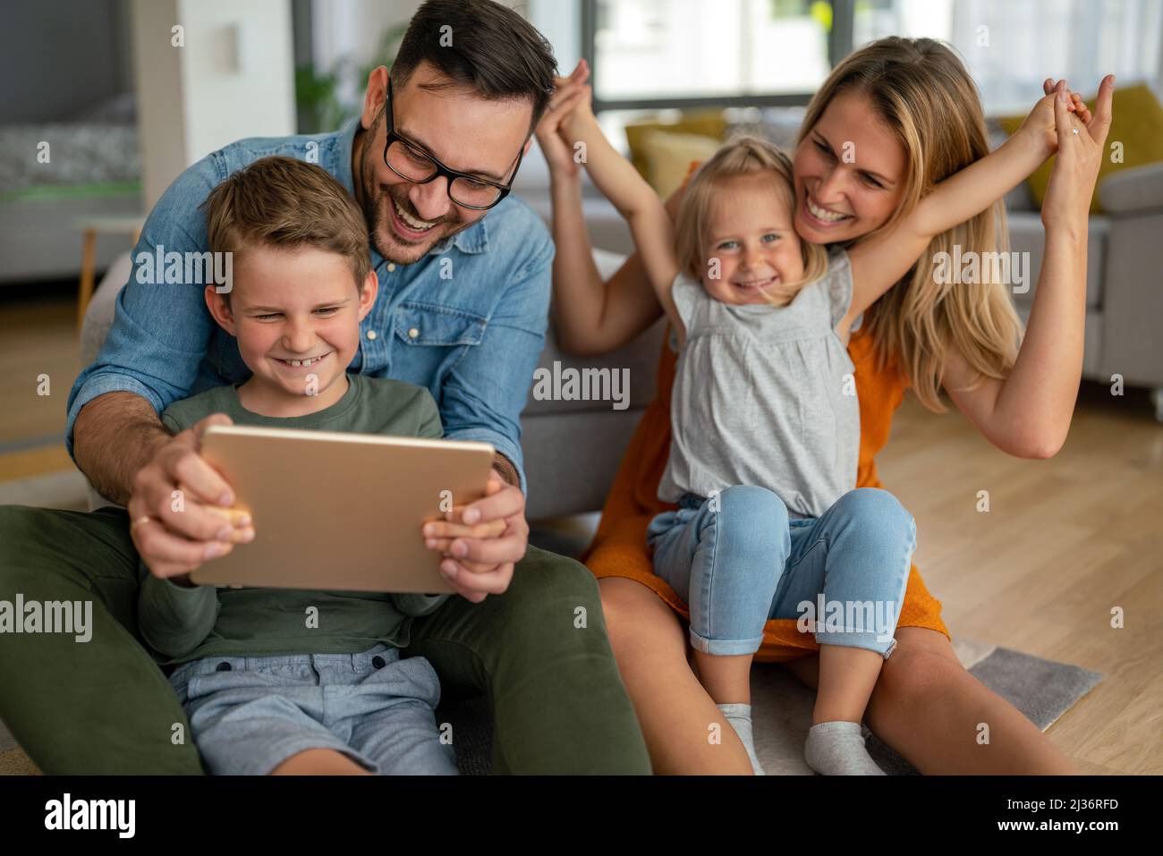 Device technology family online education concept. Happy family with ...