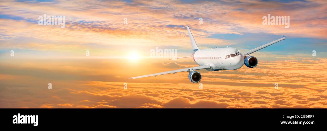 Wide panoramic view, banner of a flying passenger plane on a ...