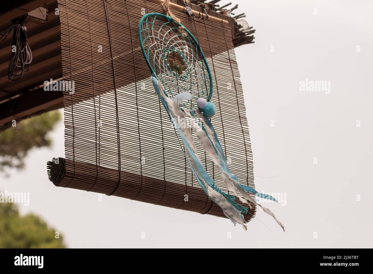 dream catcher hanging from a roof floating in the wind Stock Photo - Alamy