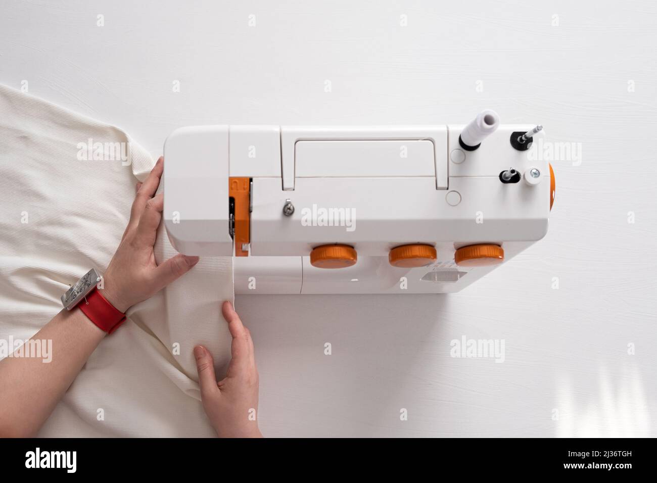 Female tailor sits sewing machine hi-res stock photography and images ...