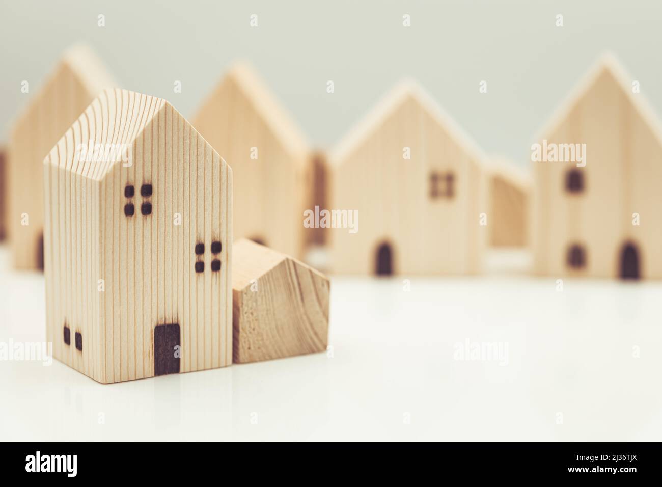 small wooden home model represent good community living together social ...