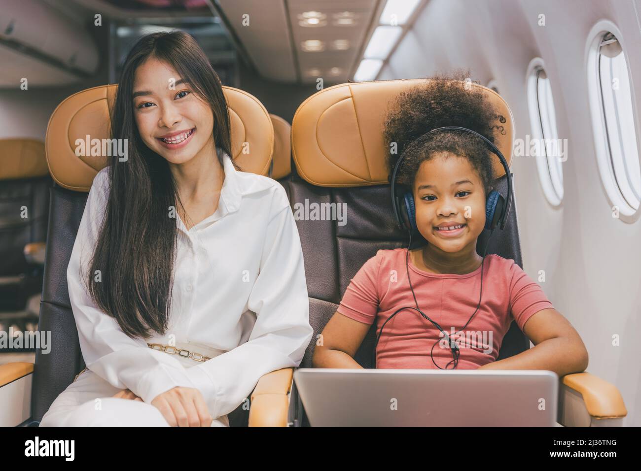 Sister with Children happy smile in flight passenger cabin happy to ...