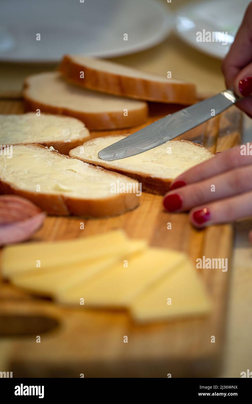 the process of making a sandwich with butter Stock Photo - Alamy
