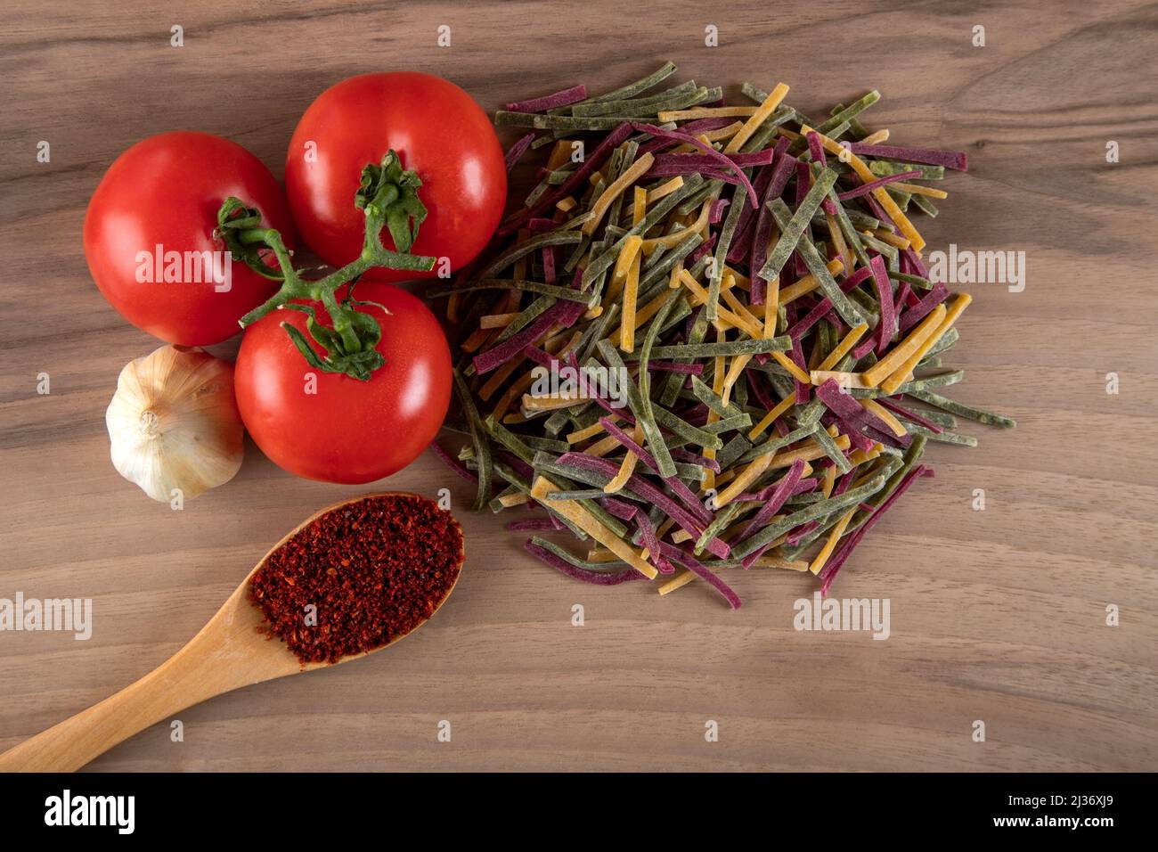 Traditional Turkish colors noodles with tomato, garlic and pepper on ...