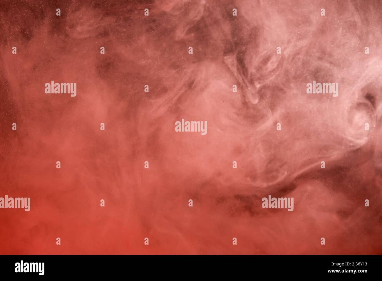 Red watercolor in water with small pieces of paint Stock Photo - Alamy