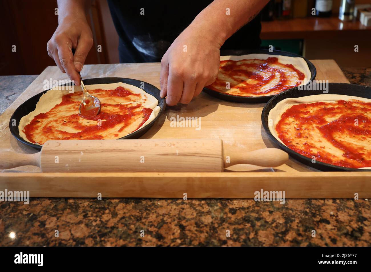 Bake original Italian pizza at home - Traditional preparation Stock ...