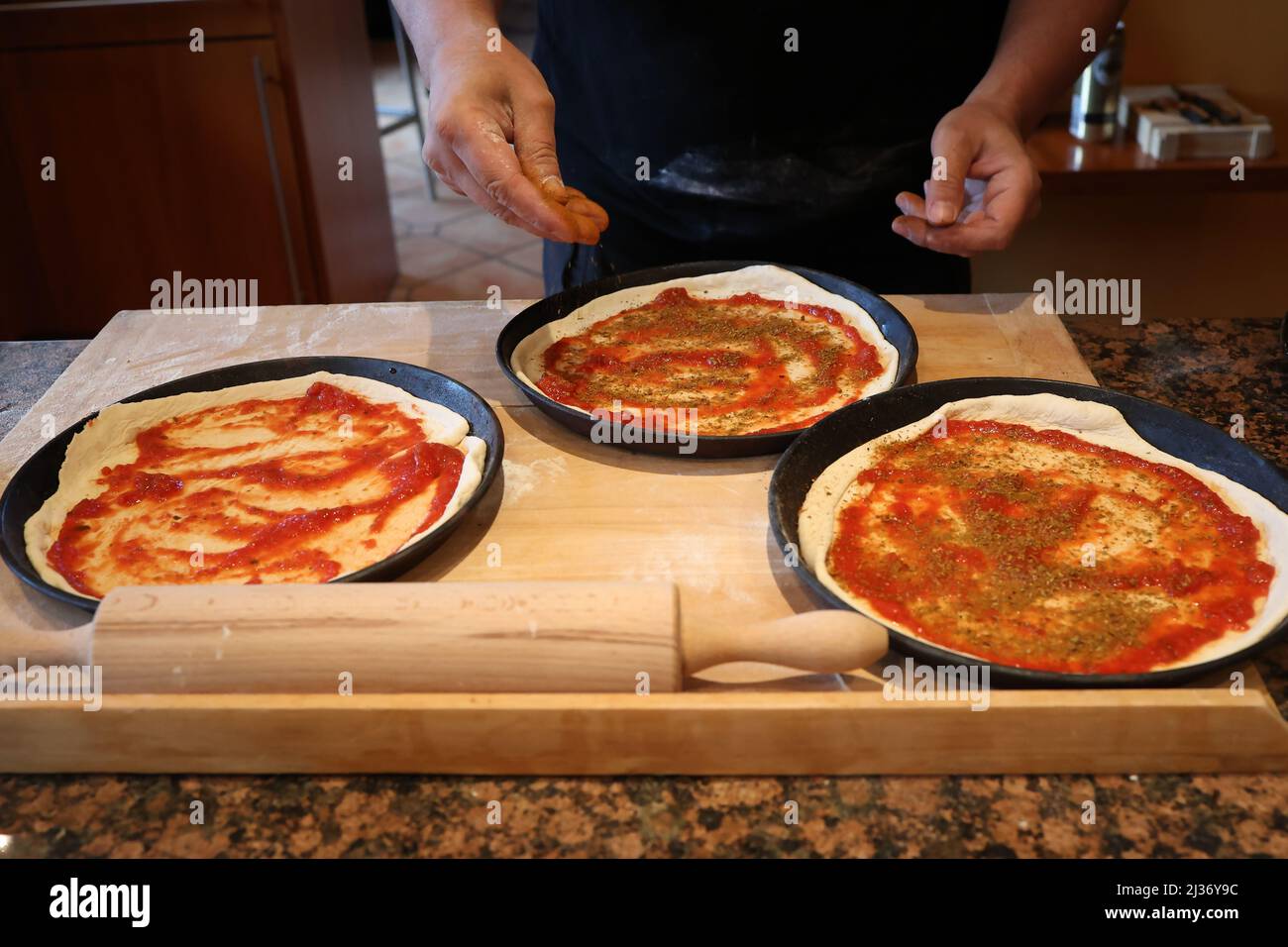 Bake original Italian pizza at home - Traditional preparation Stock ...