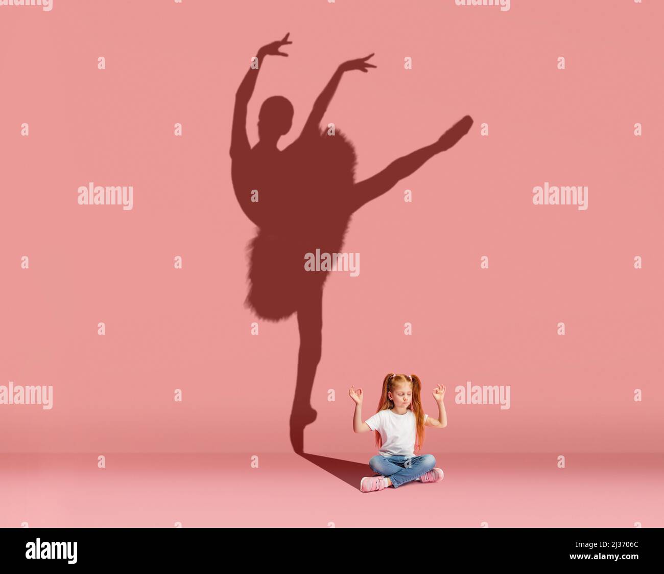 Little red-headed girl dreams of becoming a ballet dancer isolated on ...