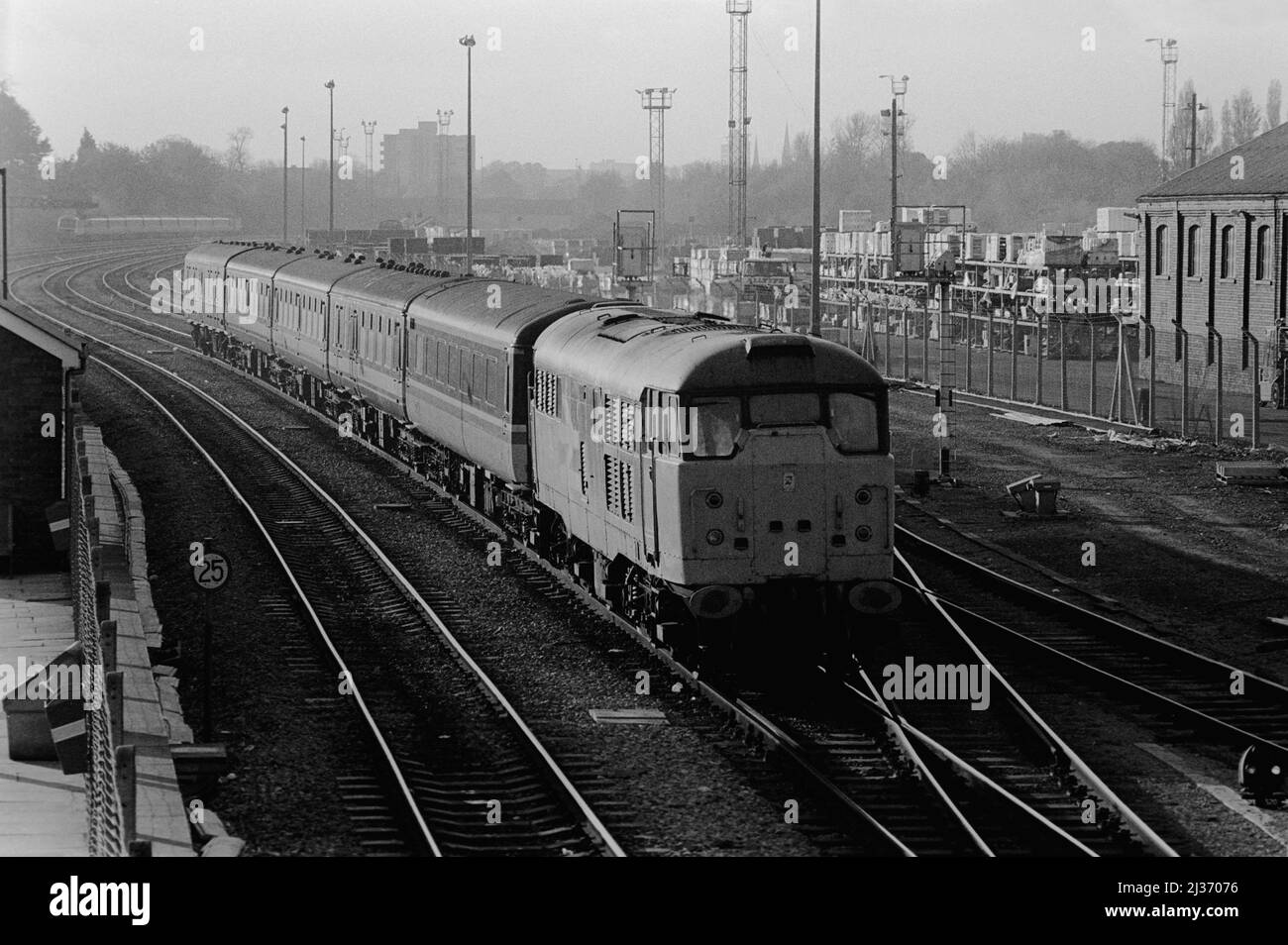 A Class 31 diesel locomotive number 31110 with a train of empty ...