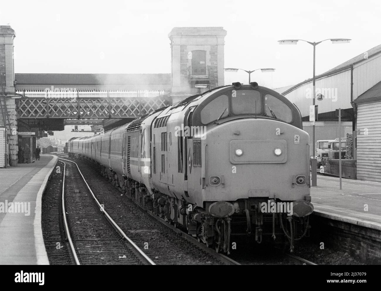 A Class 37 diesel locomotive number 37142 hauling a failed HST with ...
