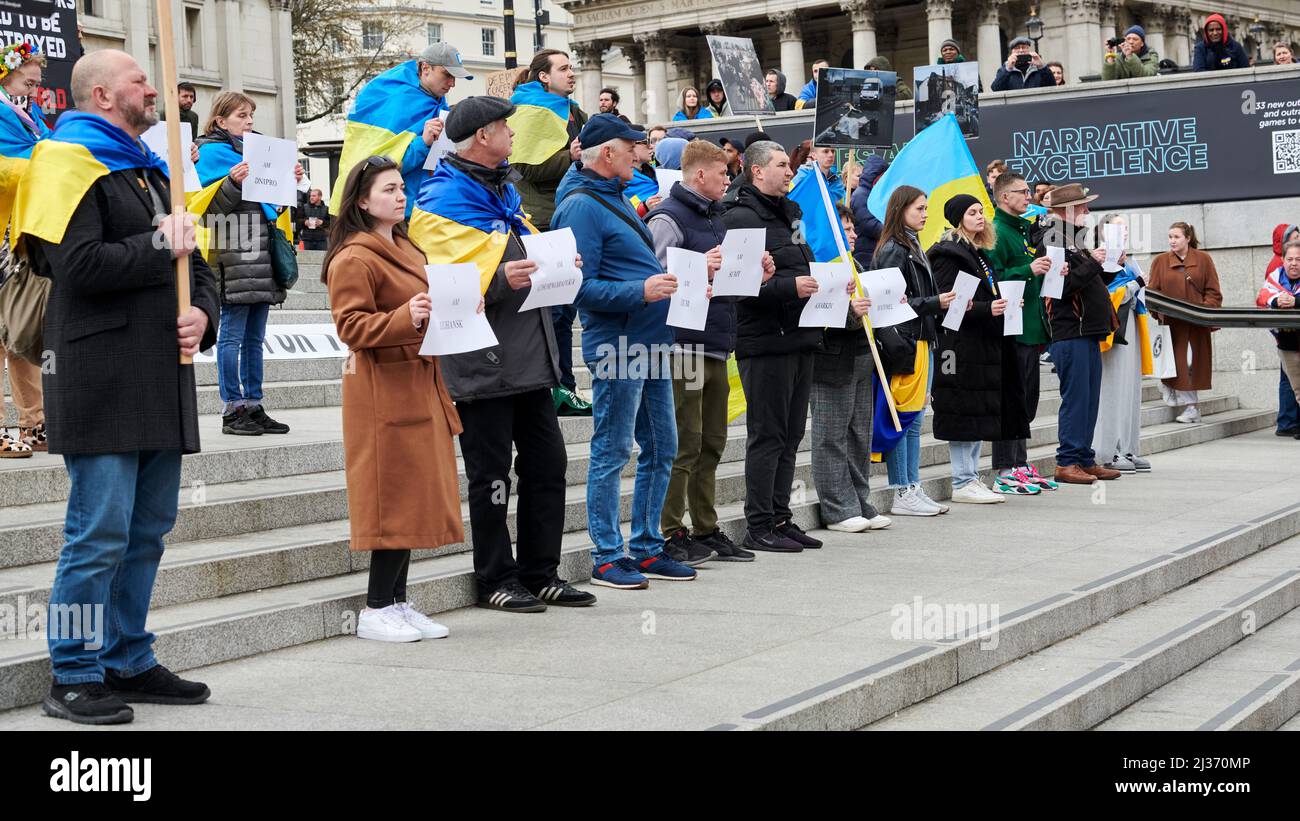 Line of demonstrators holing various 'I AM' signs facing crowd Stock ...