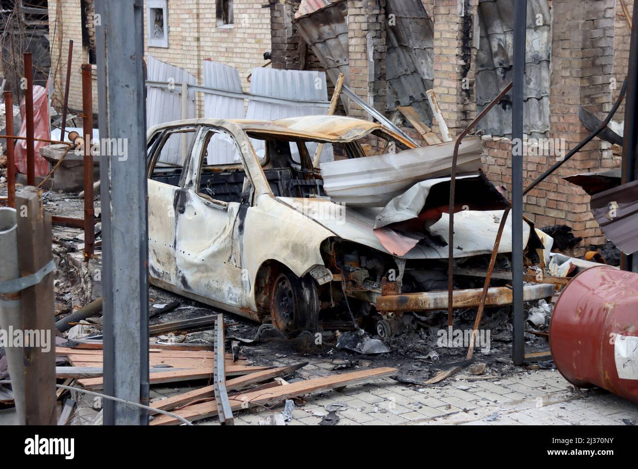 BUCHA, UKRAINE - APRIL 5, 2022 - A burnt-out car is pictured in ...