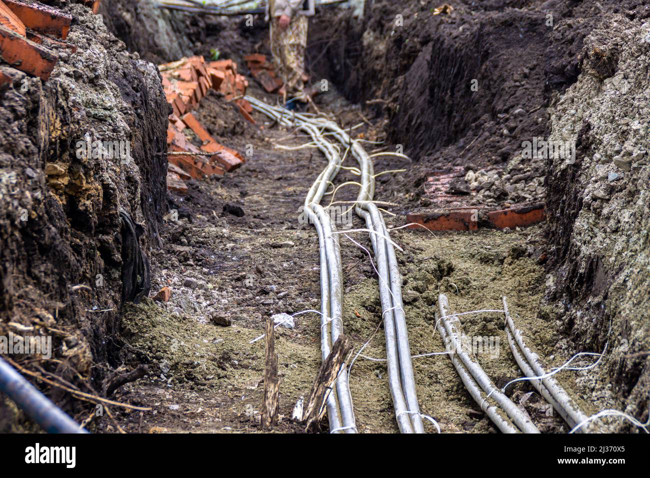 in a trench branching of cable lines lying in small gravel and ...