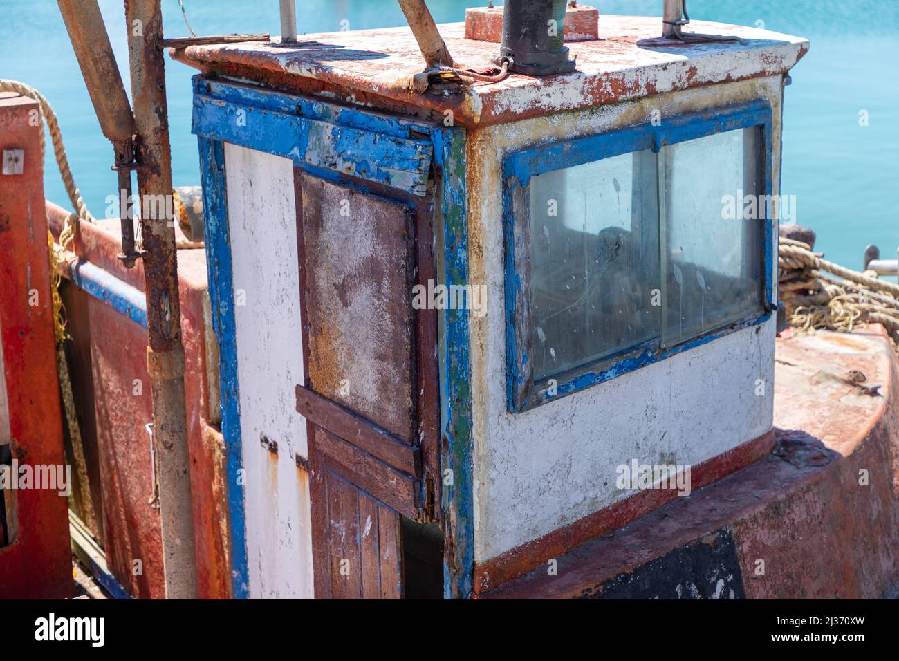 Selective focus on the door, window and cabin of an old disused fishing ...