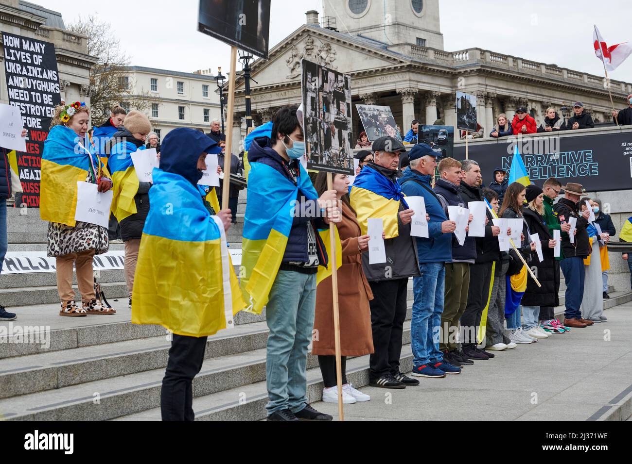 Line of people holding placards Stock Photo - Alamy