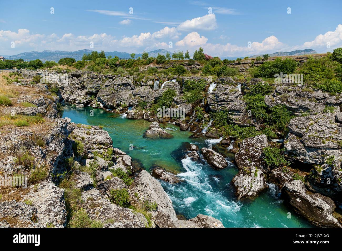 Big and fast river turning into waterfall in Podgorica. Landscapes ...