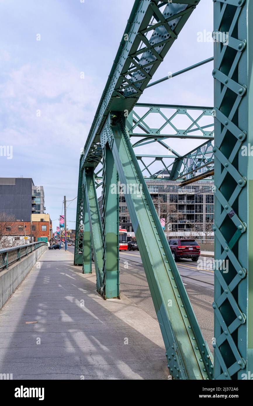 Metallic Pratt truss bridge known as the Queen St. Viaduct (1911). The ...