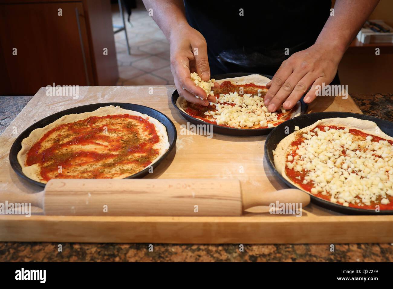 Bake original Italian pizza at home - Traditional preparation Stock ...