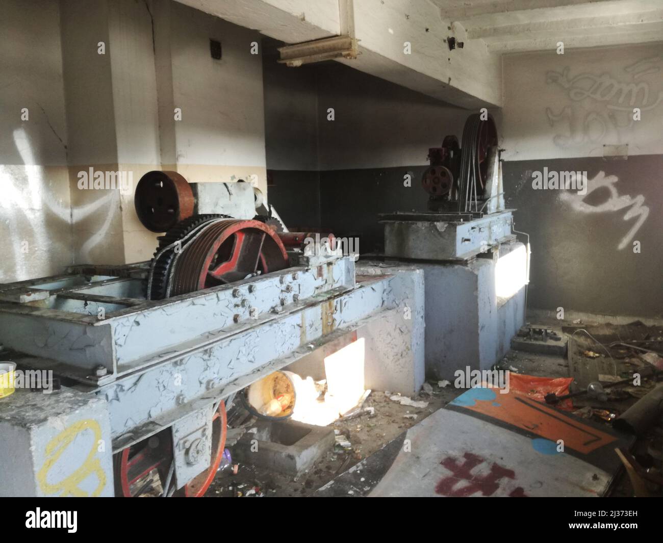 06.03.2018 Warsaw, Poland. Old rusty elevator motor with graffiti. High ...
