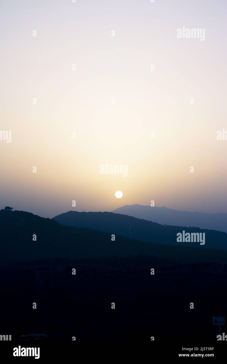 Sunset in the mountains with the sun. No people Stock Photo - Alamy