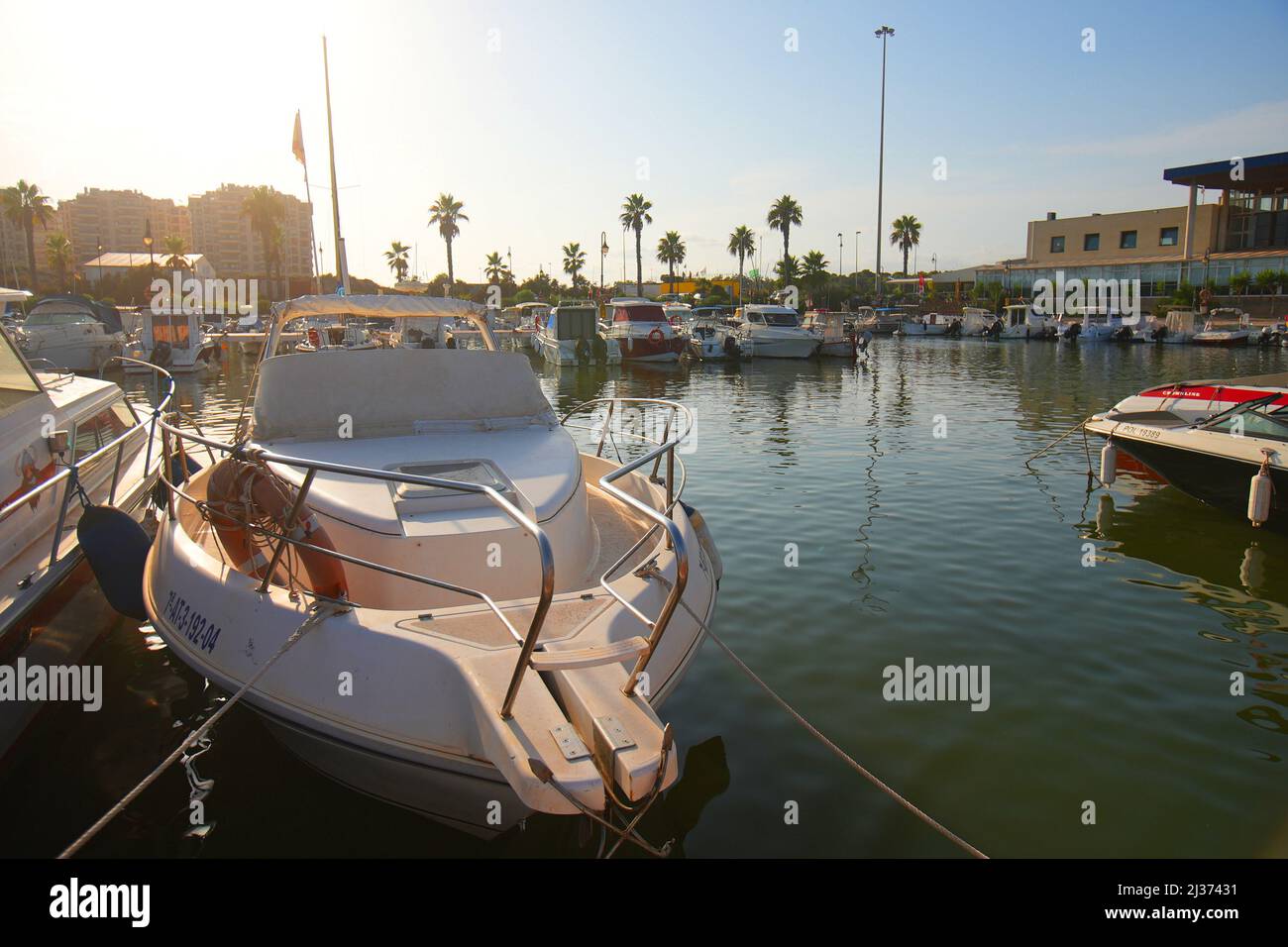 Docking bay at Spanish town with palm trees. High-quality photo Stock ...