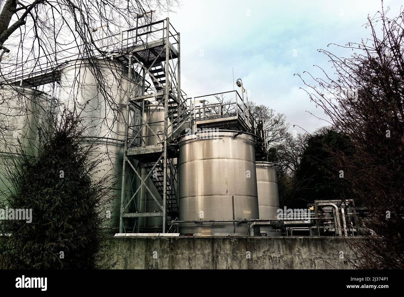 Large steel industrial vats or containers for gas or chemicals, with ...