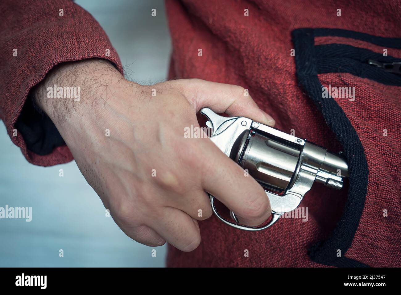 a man takes a gun out of his pocket, the concept of self-defense or ...