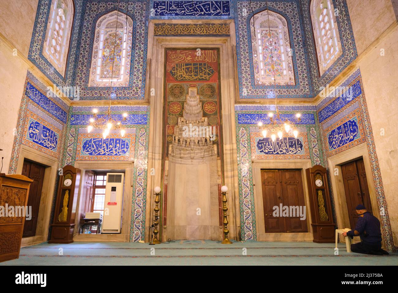 An interior view of the mosque with one man praying, including the ...