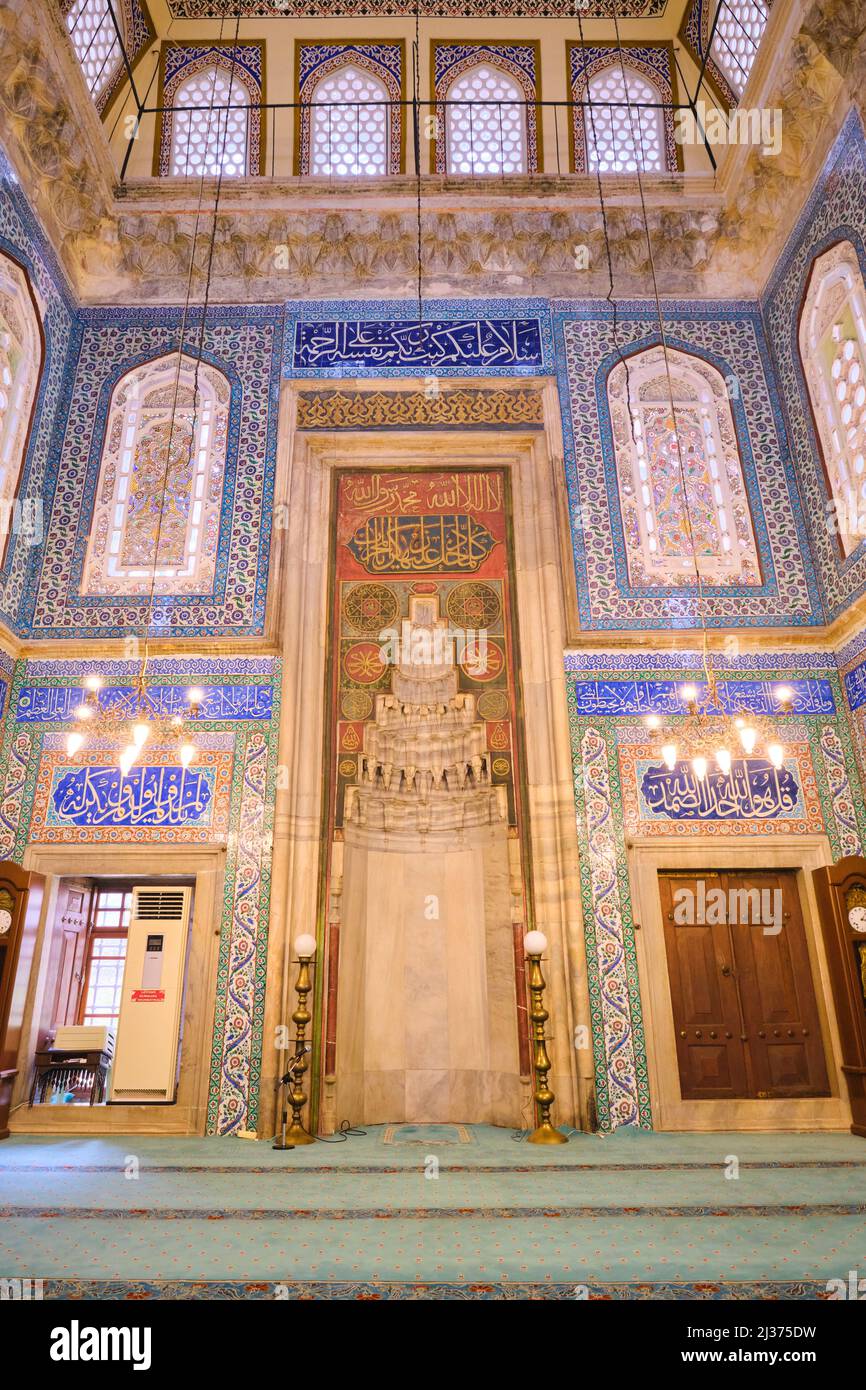 An interior view of the mosque, including the central mihrab. At the ...