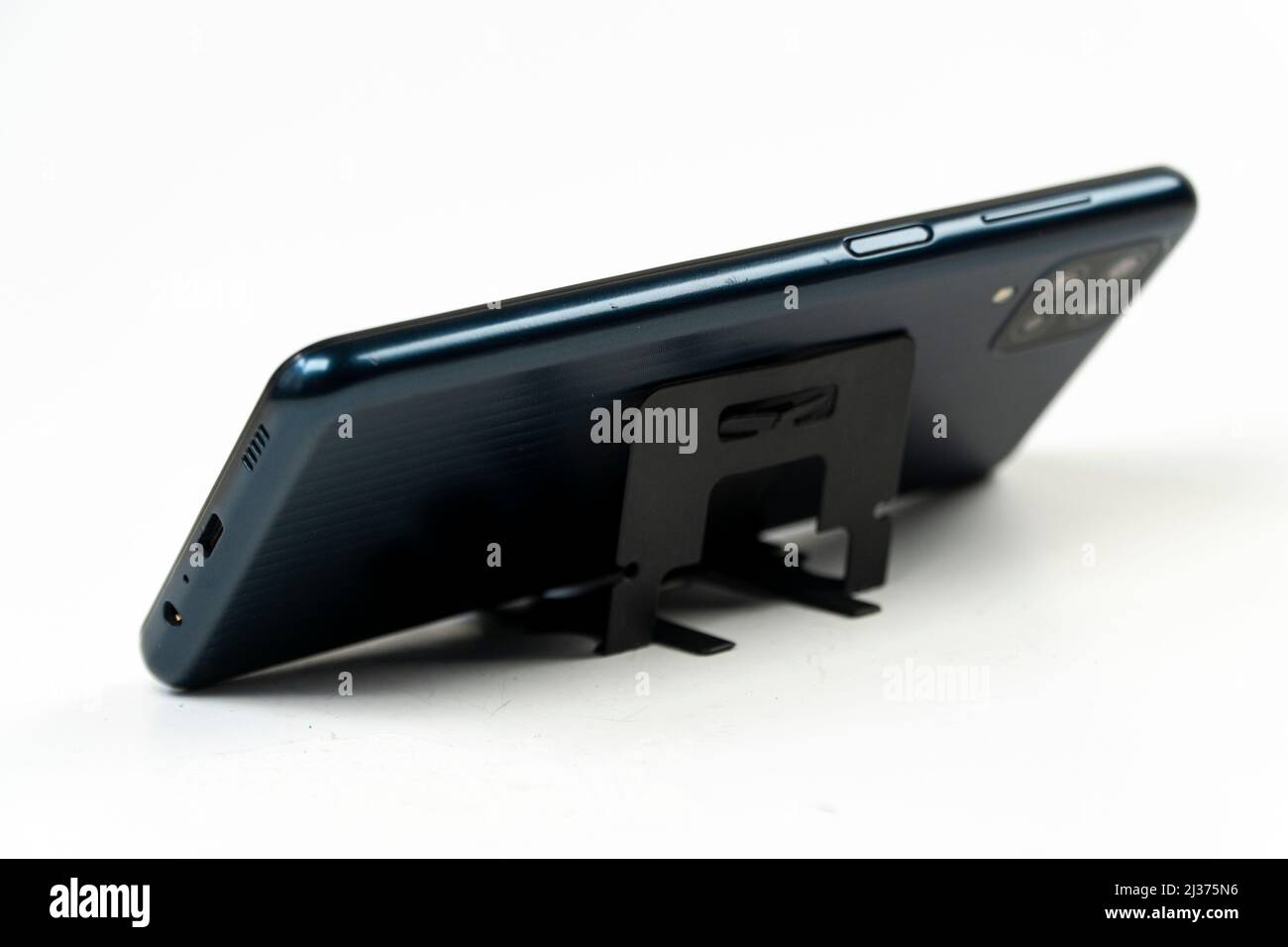 Plastic phone stand isolated on white background, black phone stand for ...