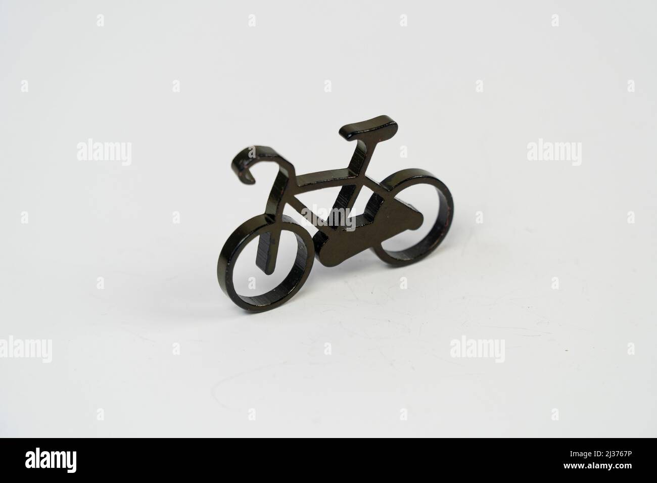 Bicycle toy object isolated on white background, black bike miniature ...