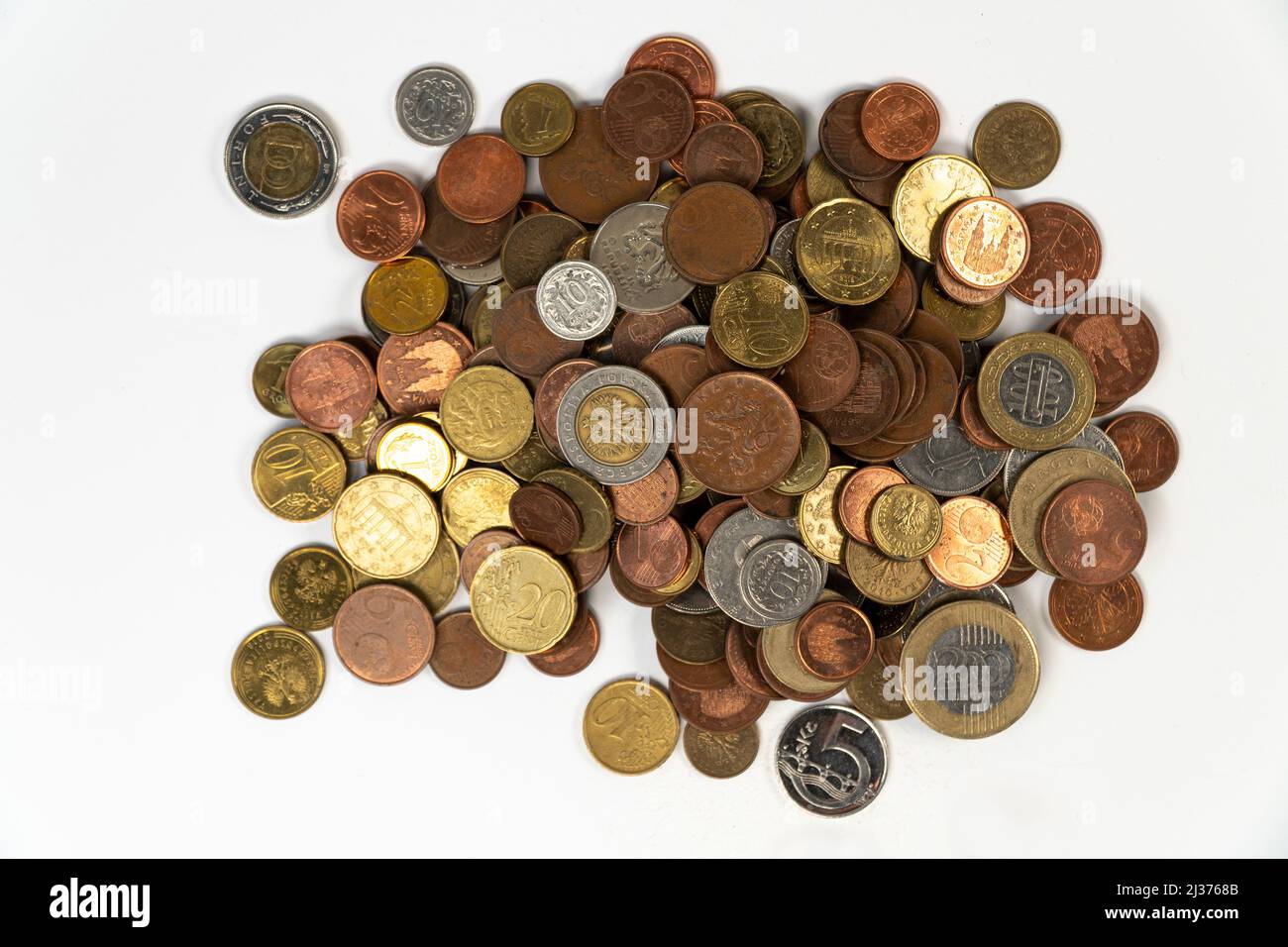 Metal pile of coins isolated on white background, different change ...