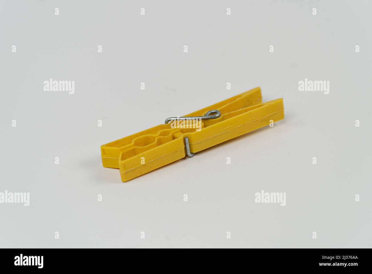 Clothes peg isolated on white background, single yellow clothes pegs ...