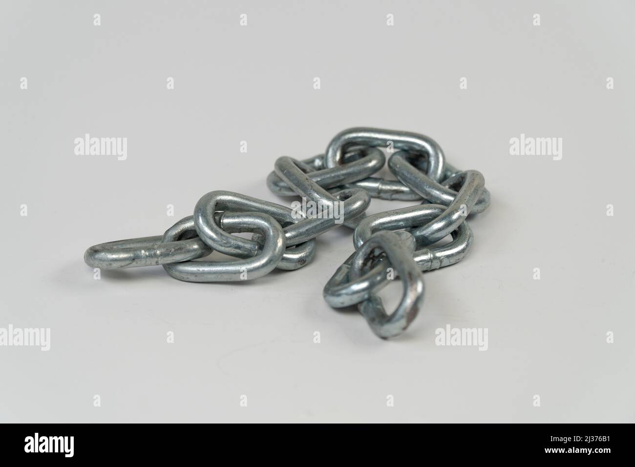 Iron chain on platform with isolated on white background, silver chain ...