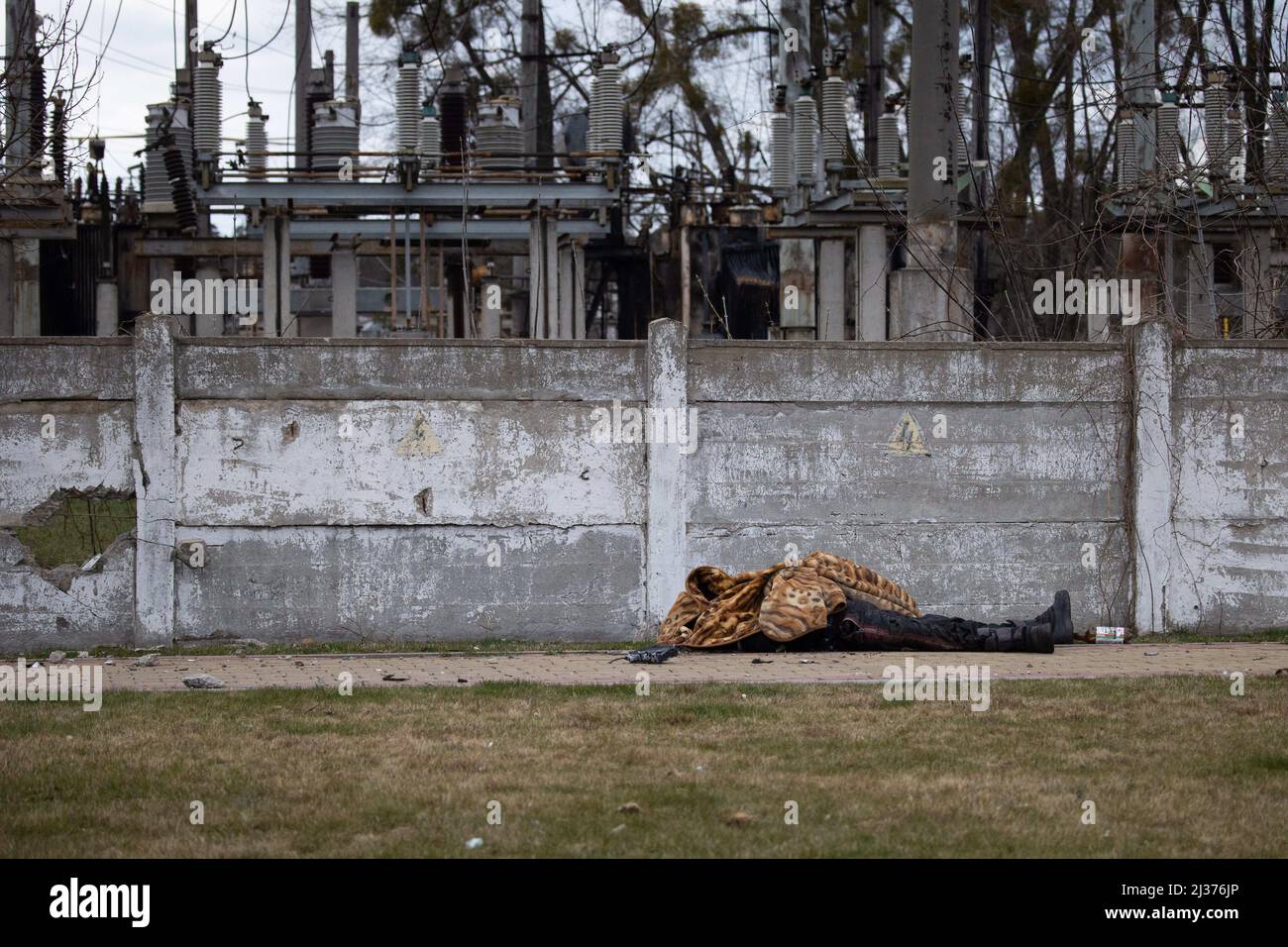 The corpse of a dead civilian in the town of Bucha, northwest of the ...