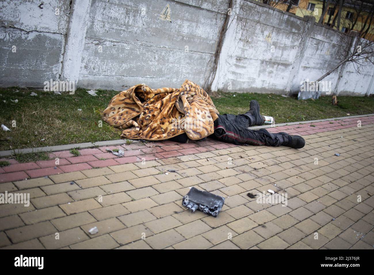 The corpse of a dead civilian in the town of Bucha, northwest of the ...