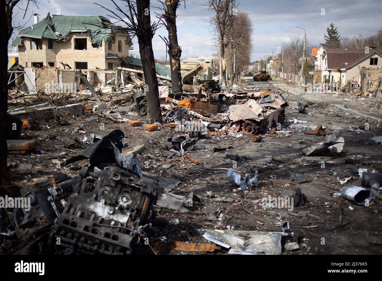 Street filled with exploded tanks and destroyed buildings in the town ...
