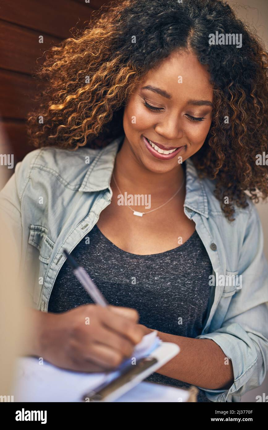 That was quick and convenient. Shot of a young woman signing for her ...