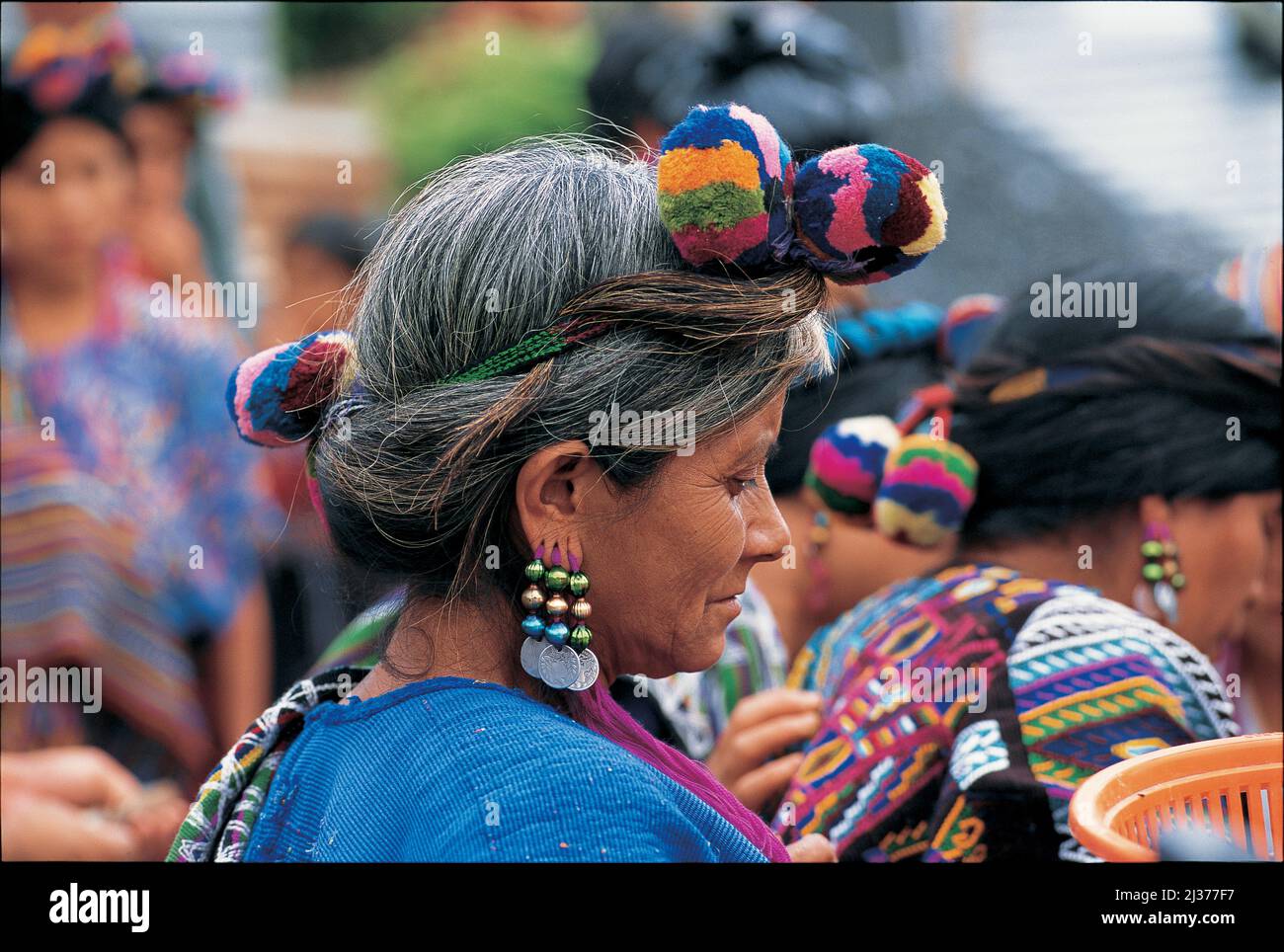 Mayan woman wearing headdress & earrings of antique coins. Chajul, Ixil ...