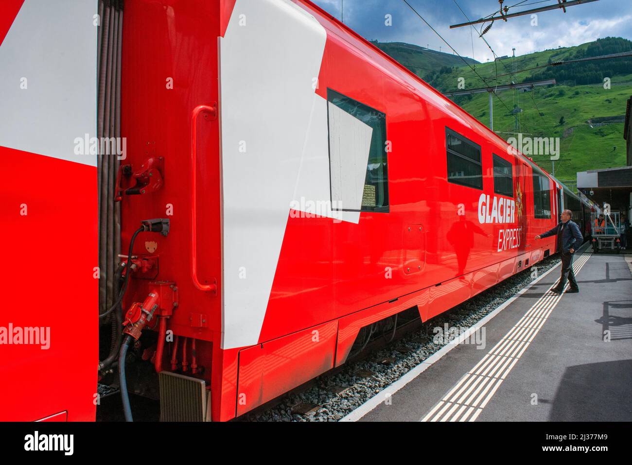 The glacier express train stoped in Andermatt station. This train goes ...