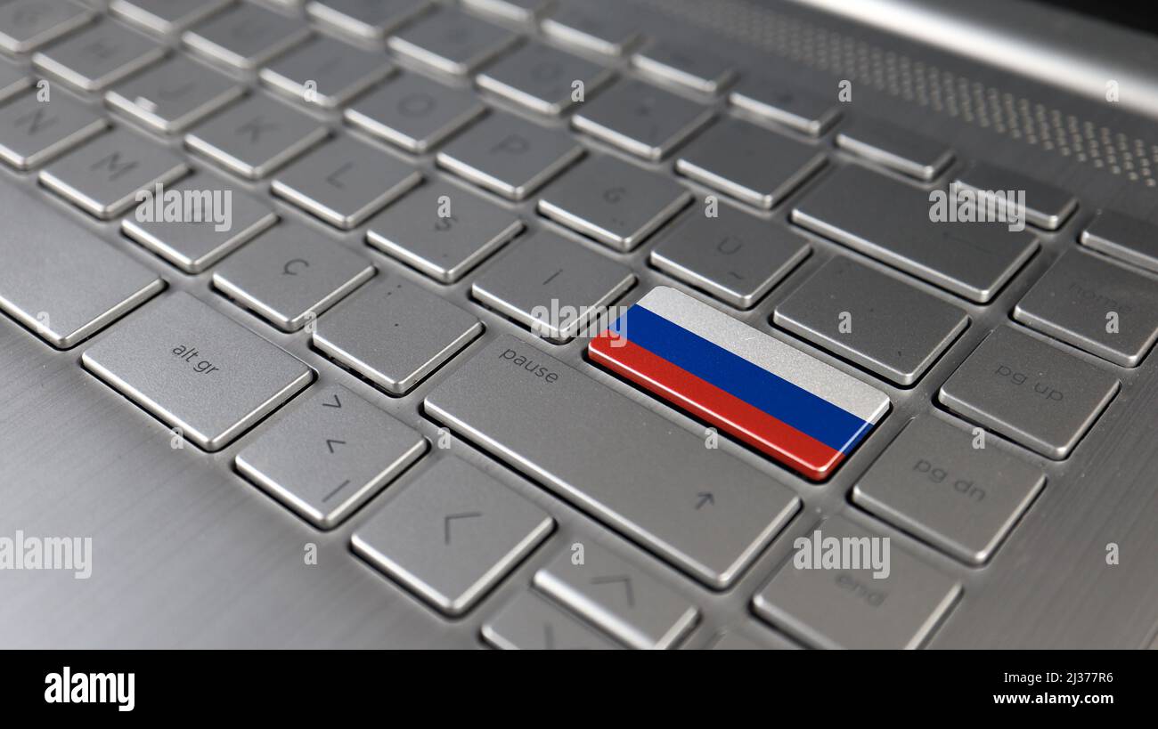 Keyboard with Russia flag on the enter button, represents cyber attack ...